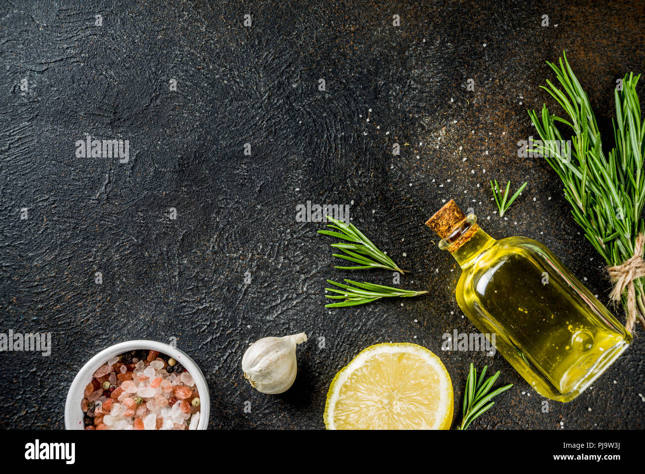 Cooking food ingredients background. Spices, garlic, herbs, olive oil ...