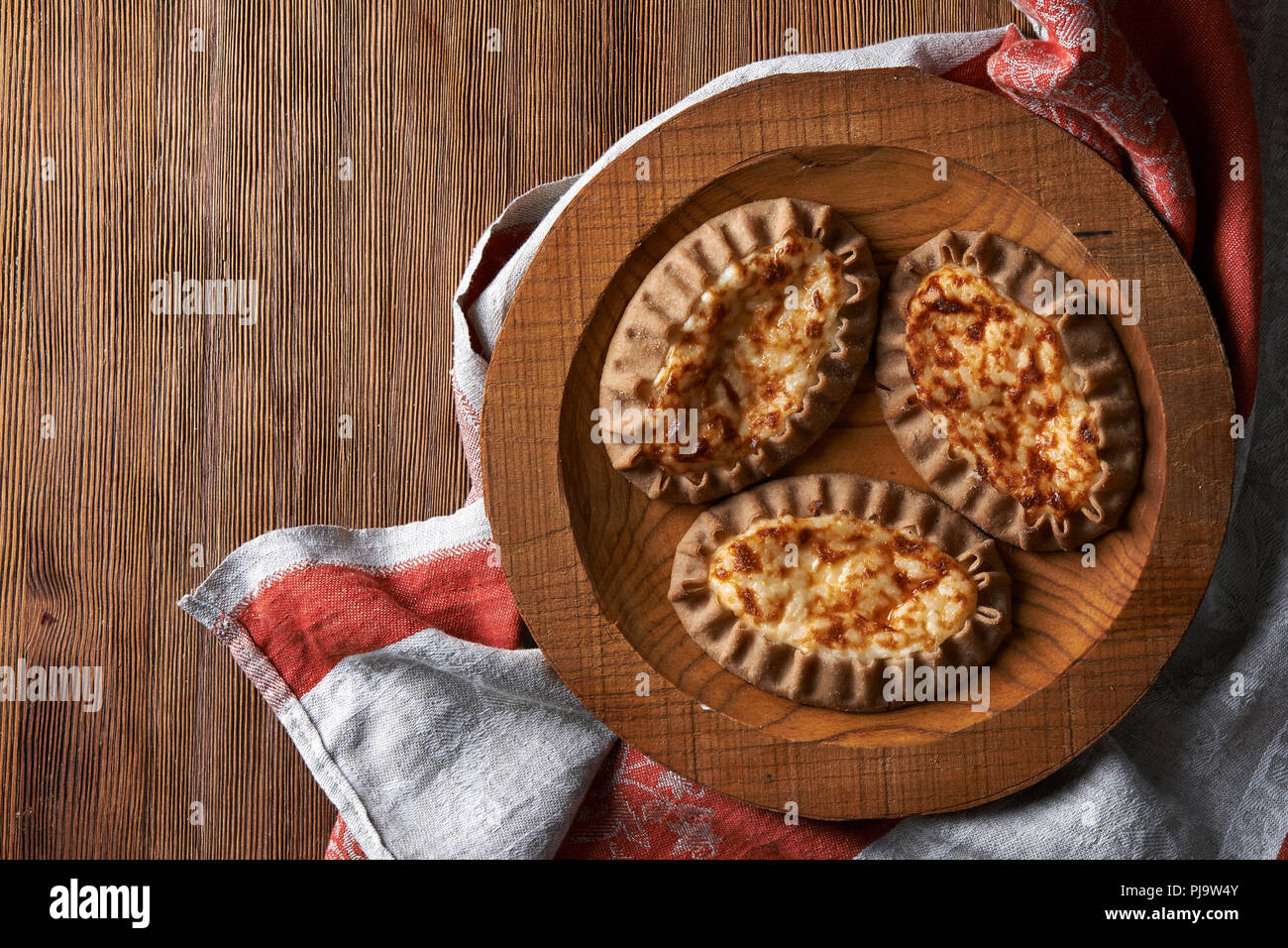 traditional karelian pie over wooden background Stock Photo - Alamy