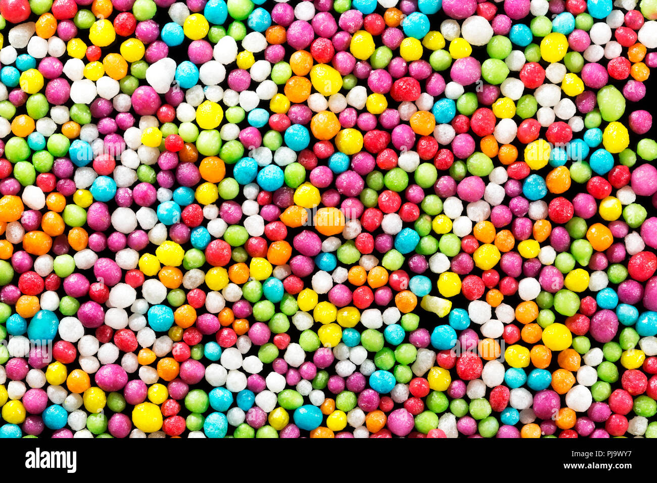 Colorful eatable sugar pearls for food decoration. Useful for a sweet ...