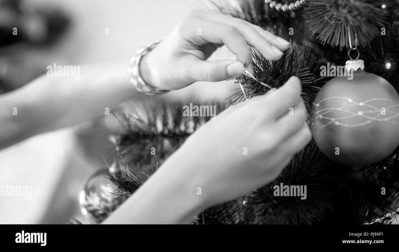 Decorating tree child hanging Black and White Stock Photos & Images - Alamy