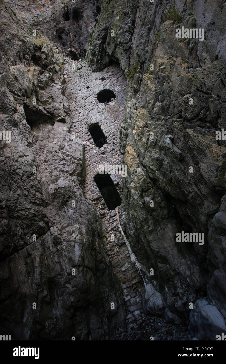 Culver Hole is a walled-up cave on the sheer limestone cliffs of the ...