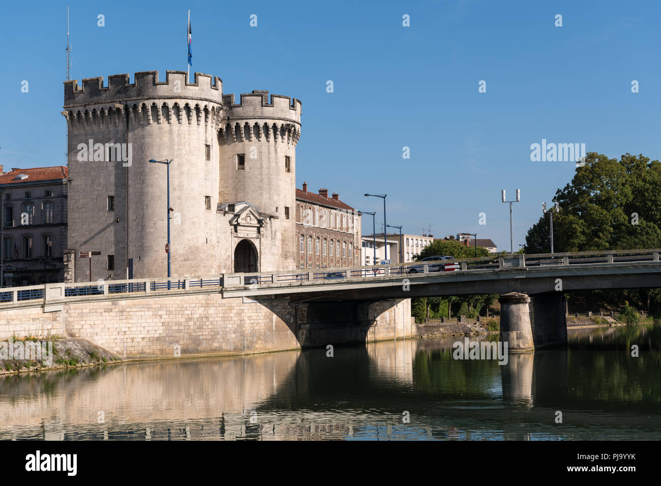 City gate and bridge over river Meuse in Verdun (France) on a sunny day ...