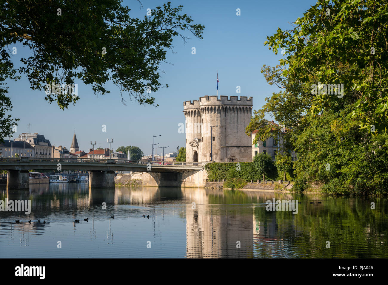City gate and bridge over river Meuse in Verdun (France) on a sunny day ...