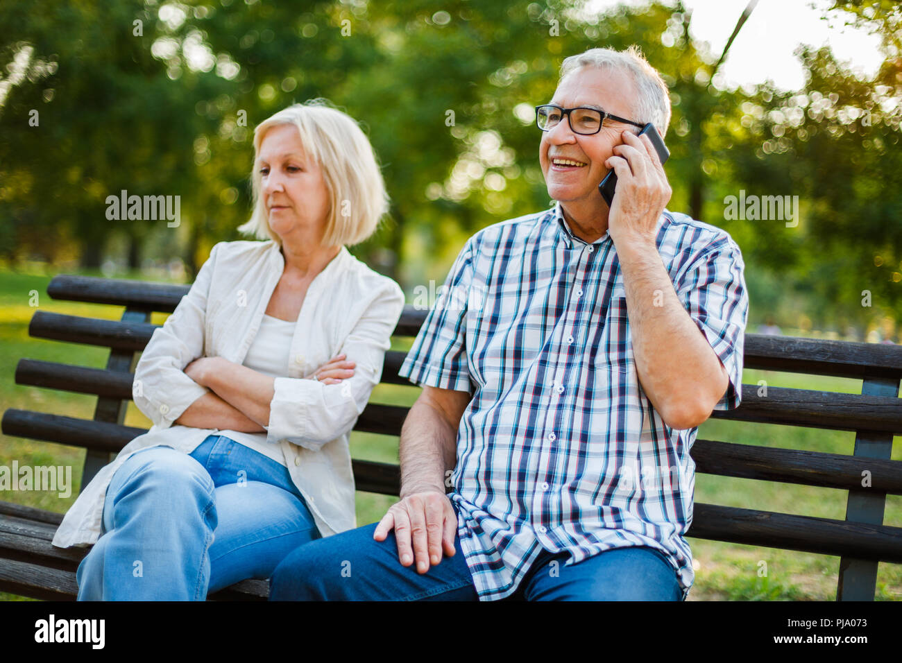 Senior woman phone angry hi-res stock photography and images - Alamy