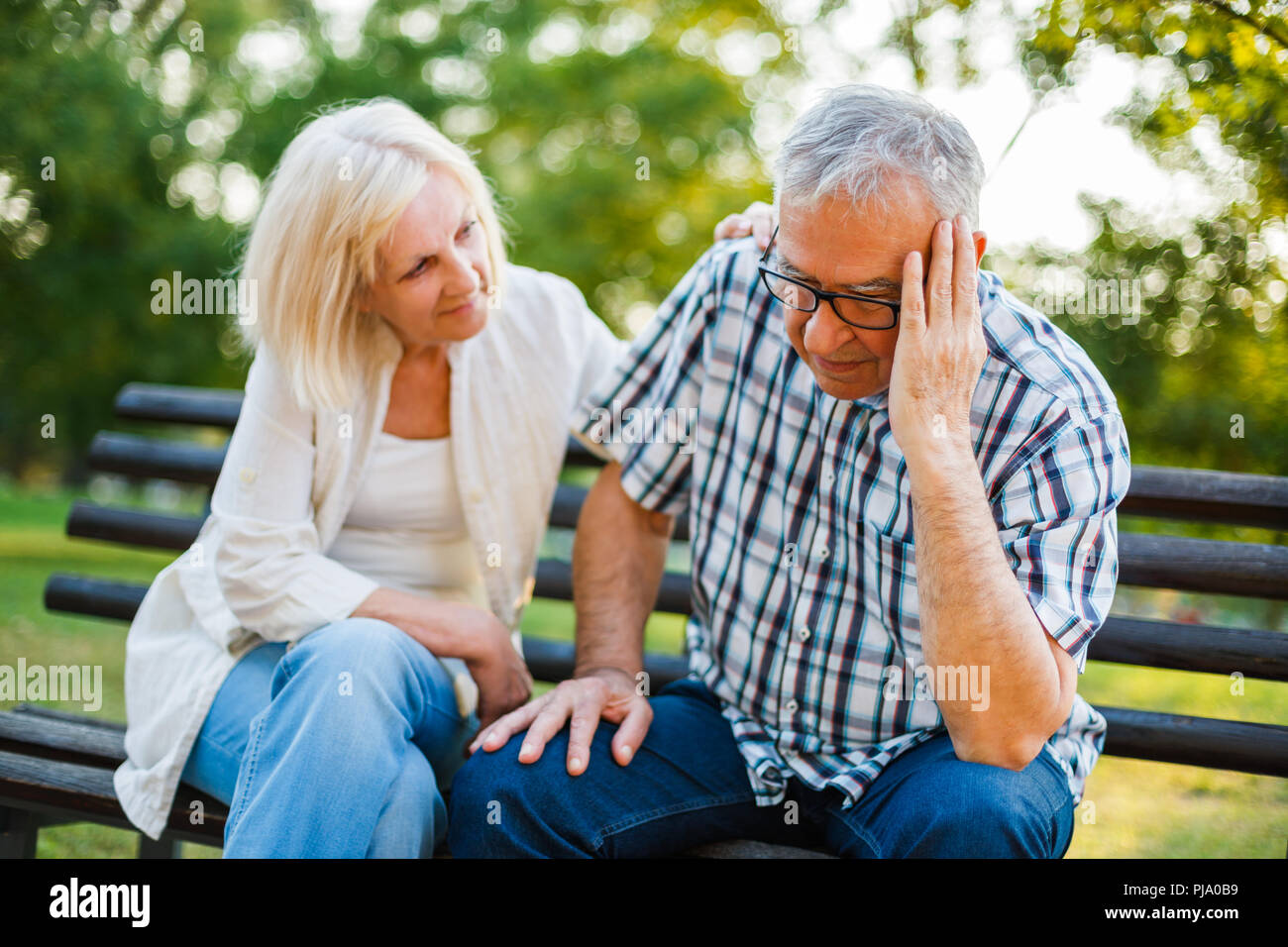 Senior man is sad and depressed. Friend is consoling him Stock Photo ...