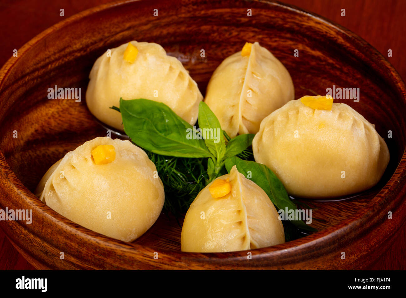 Uzbek traditional dumplings - Manti with meat Stock Photo - Alamy