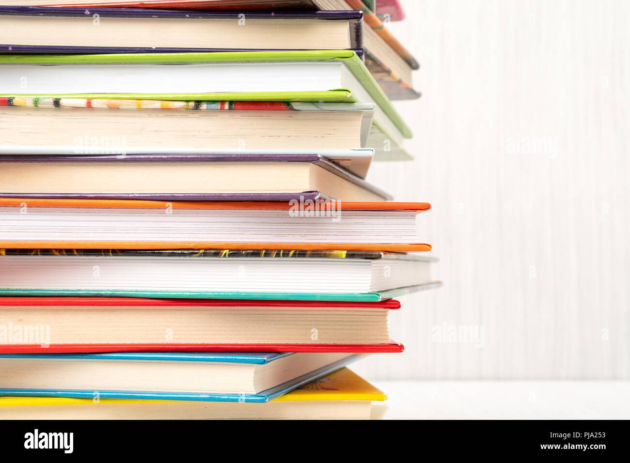 Books stacked in the library room, education background, back to school ...