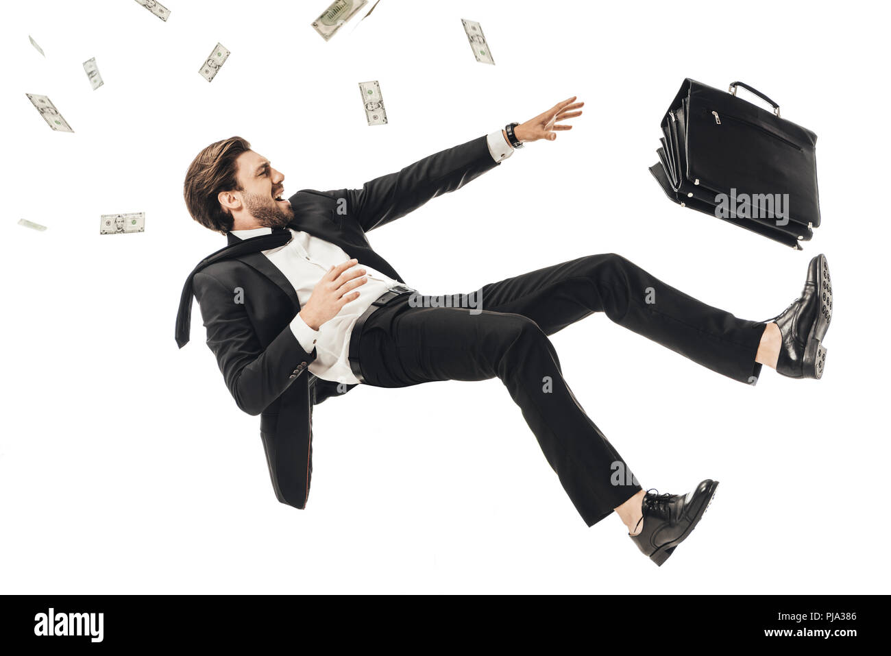 shouting young businessman falling with money and briefcase isolated on ...