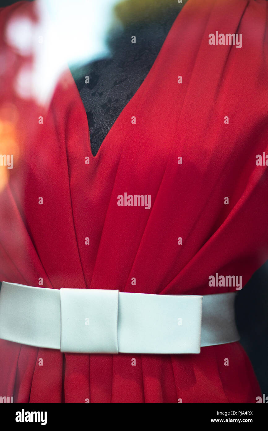 Wedding boutique guests red marriage dress in store window display on ...