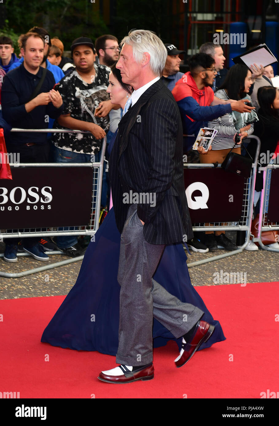 Paul Weller and wife Hannah Andrews arriving for the GQ Men of the Year ...