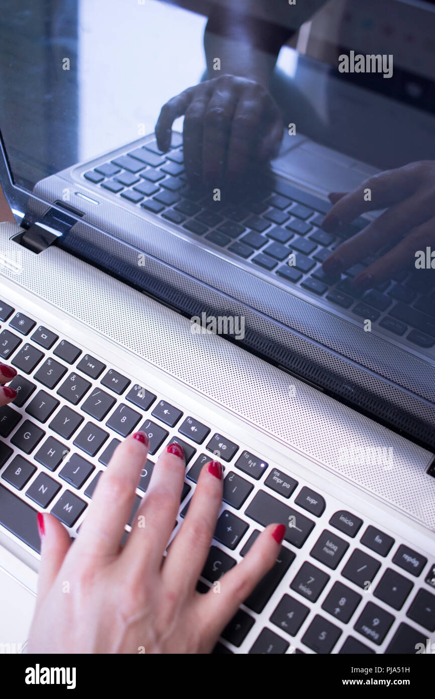 Secretary typist typing on laptop pc computer keyboard keys with hands ...