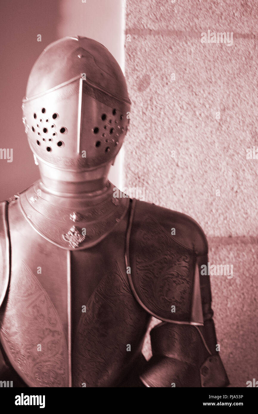 Medieval metal suit of armour and helmet worn by knight in middle ages ...