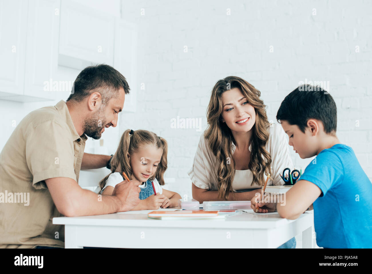 Parents help kids study hi-res stock photography and images - Alamy