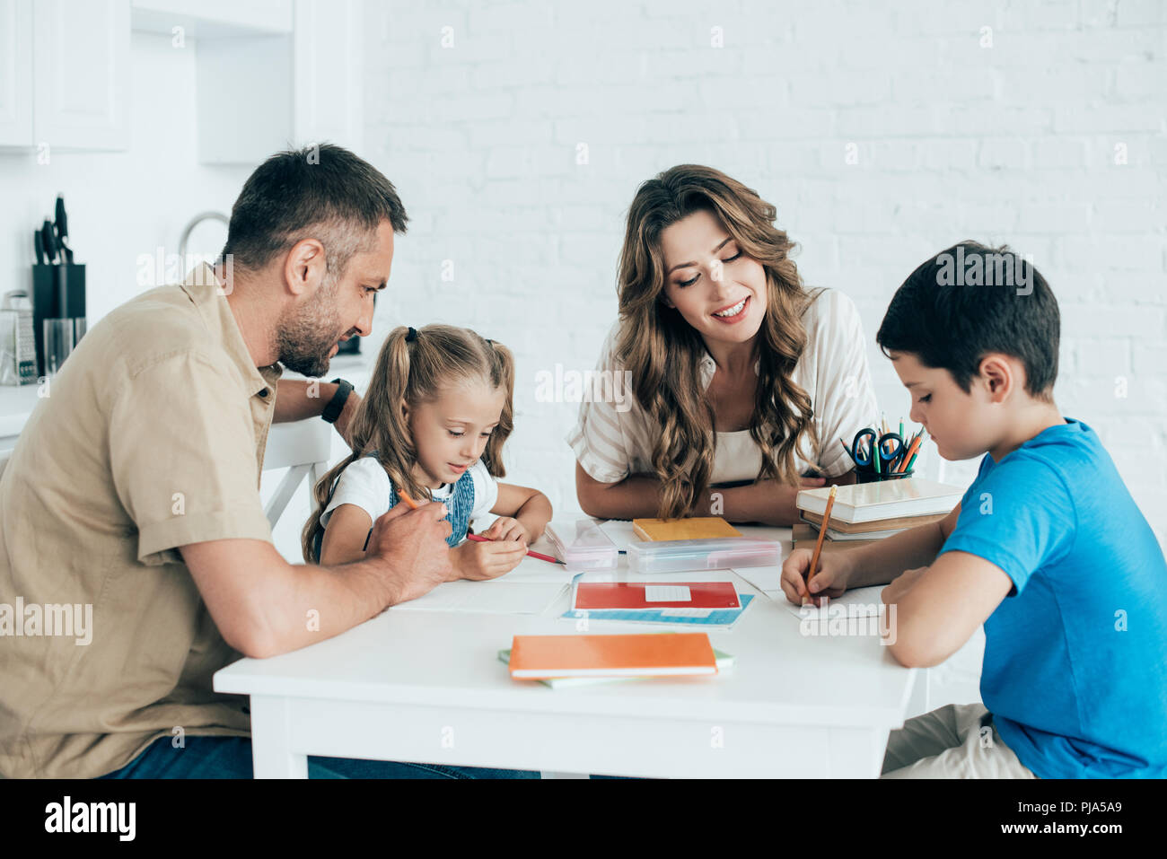Parents help kids study hi-res stock photography and images - Alamy