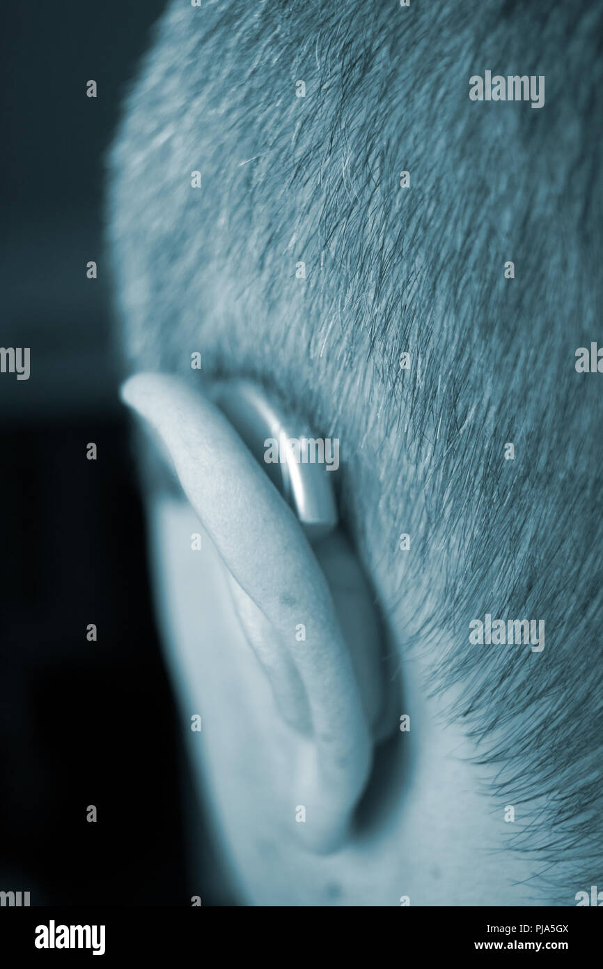 Modern compact in the ear digital audiophone hearing aid in the ear of ...