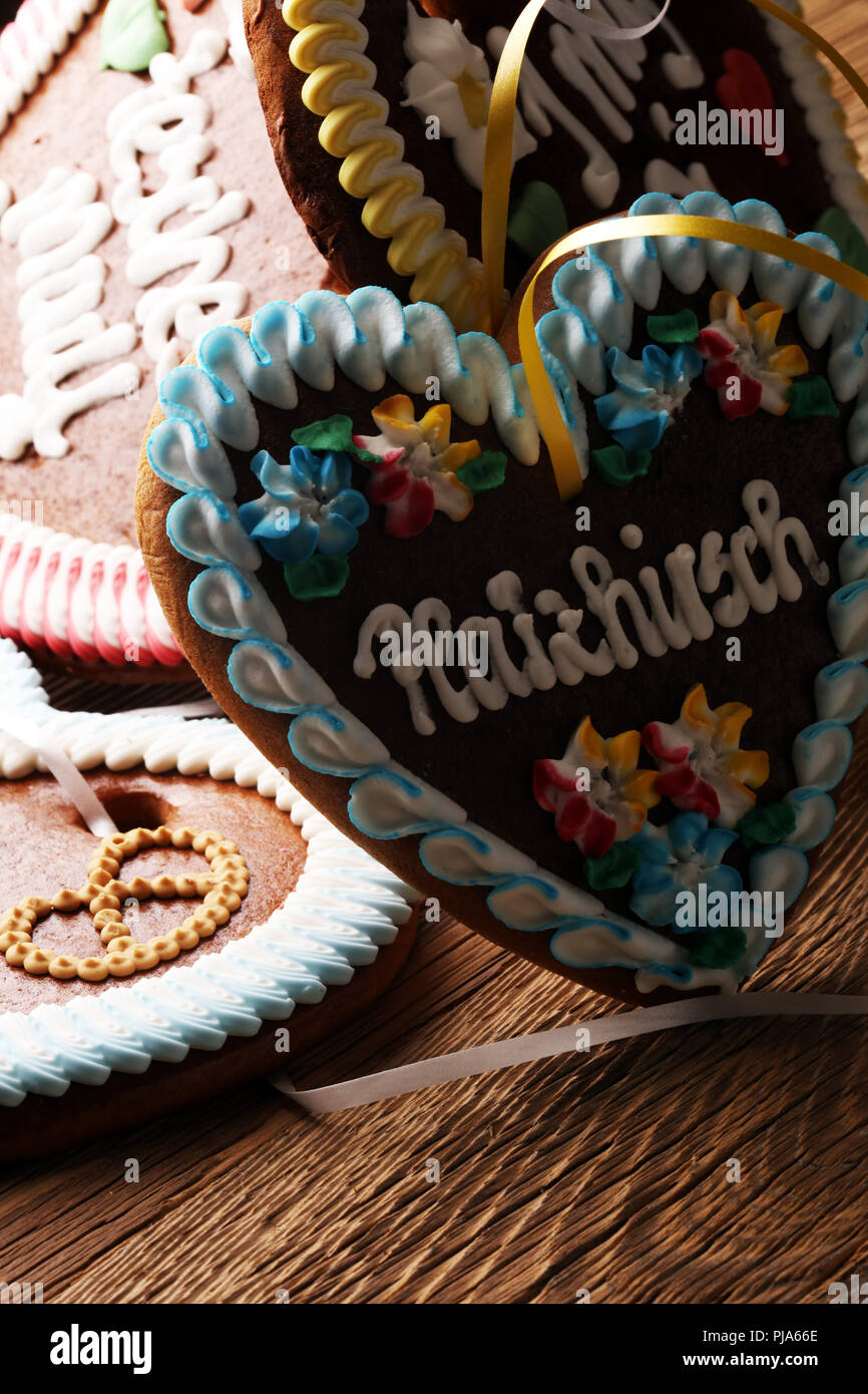 original bavarian Oktoberfest gingerbread heart on wood Stock Photo - Alamy