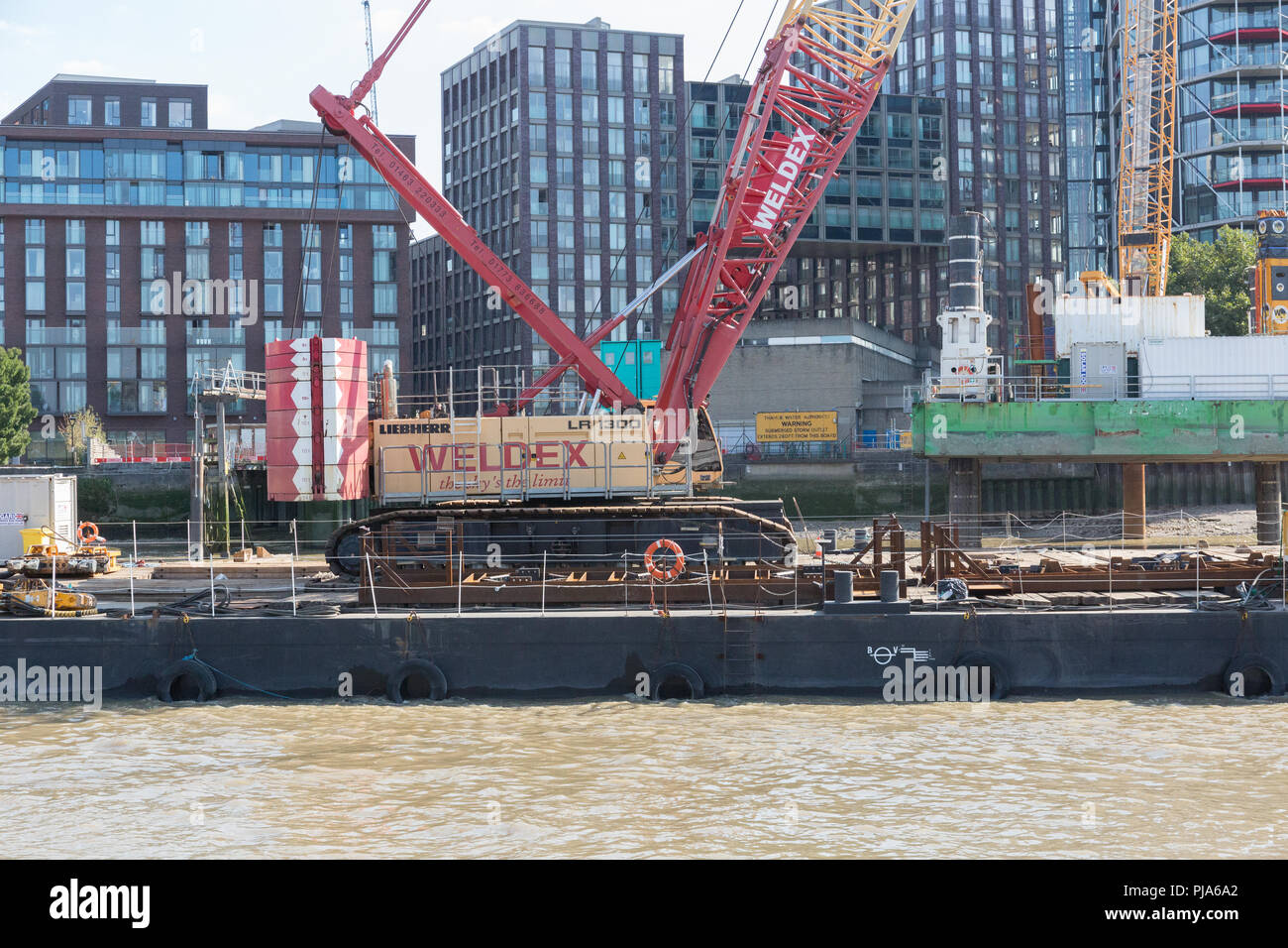 Construction barge on The River Thames Stock Photo - Alamy