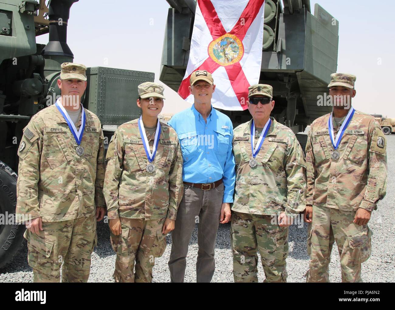 CAMP BUEHRING, Kuwait — Florida Gov. Rick Scott (center) presented the ...