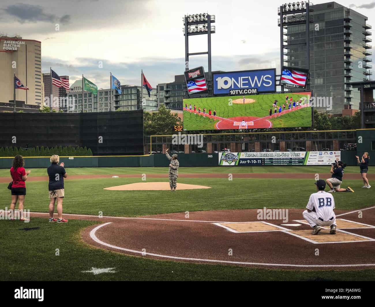 Col. Allison Miller throws the ceremonial first pitch during a Columbus ...