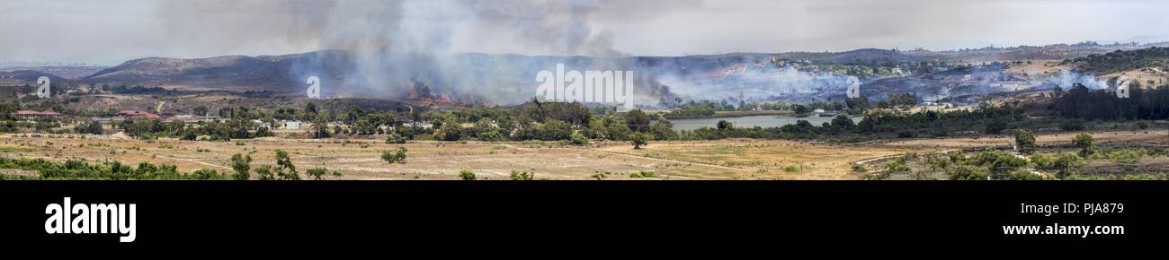 Firefighters with the Camp Pendleton Fire Department combat a fire in ...