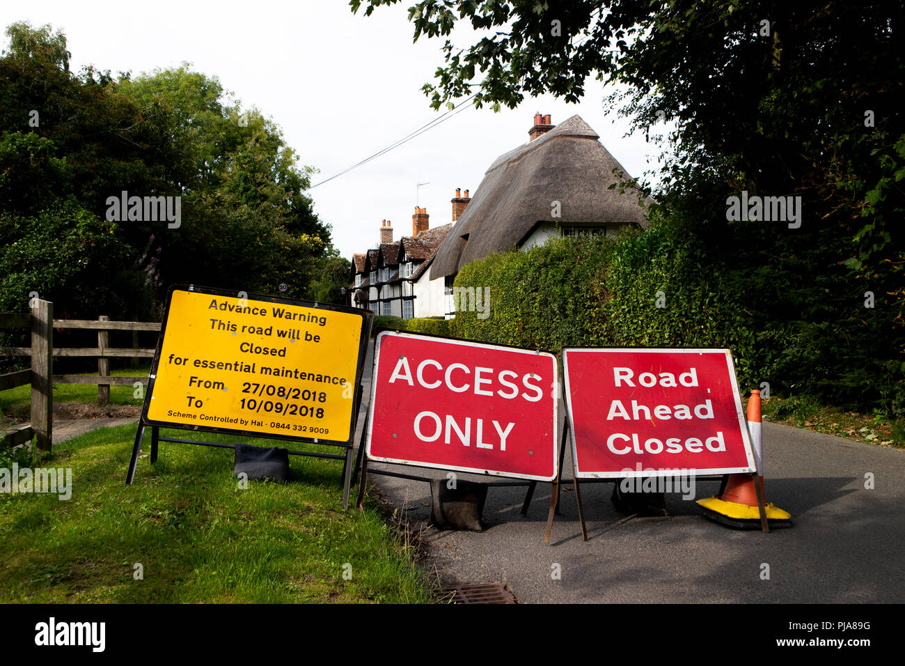 rural road through village closed for essential maintenance signs Stock ...