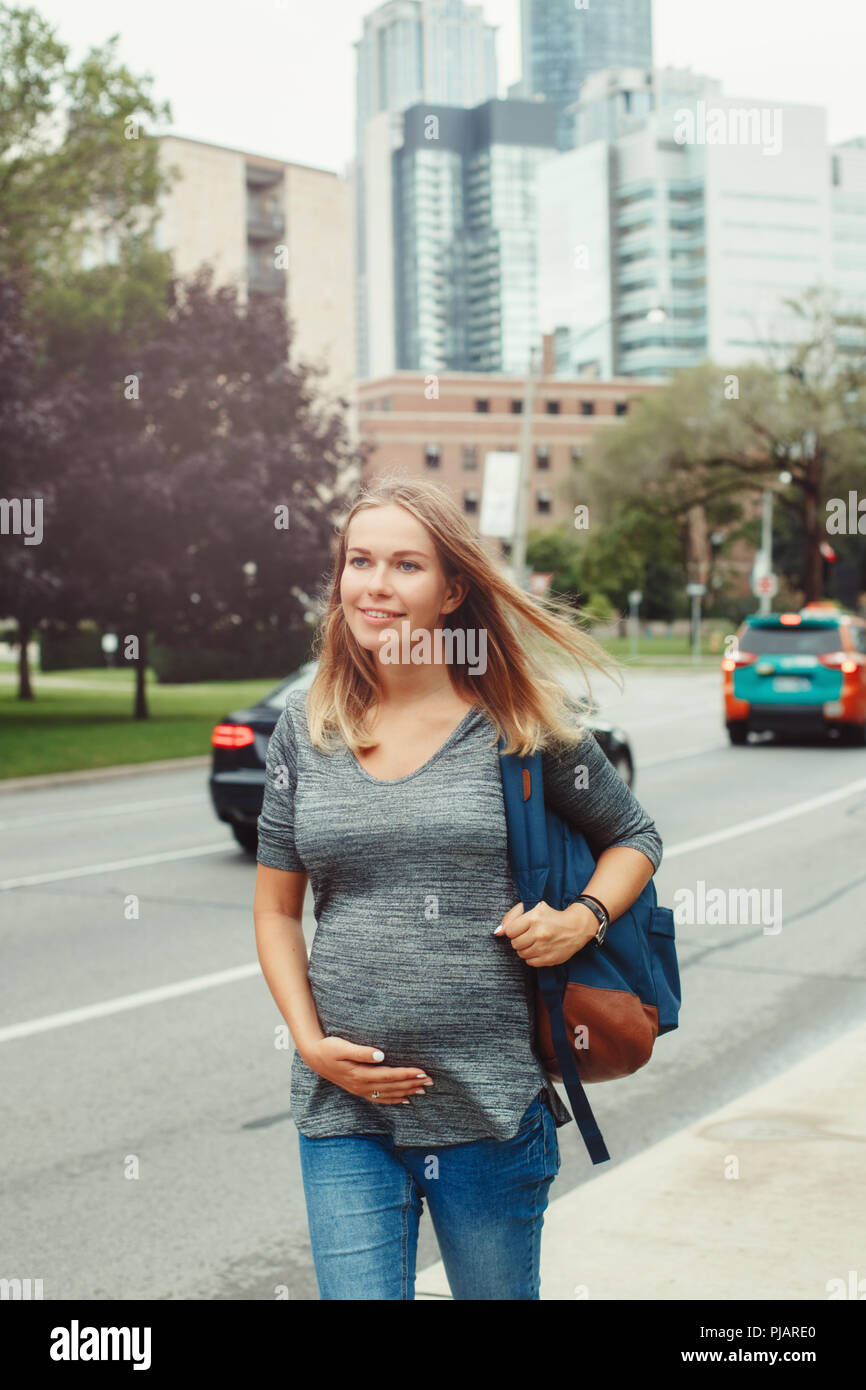 Young pregnant woman student holding hi-res stock photography and ...
