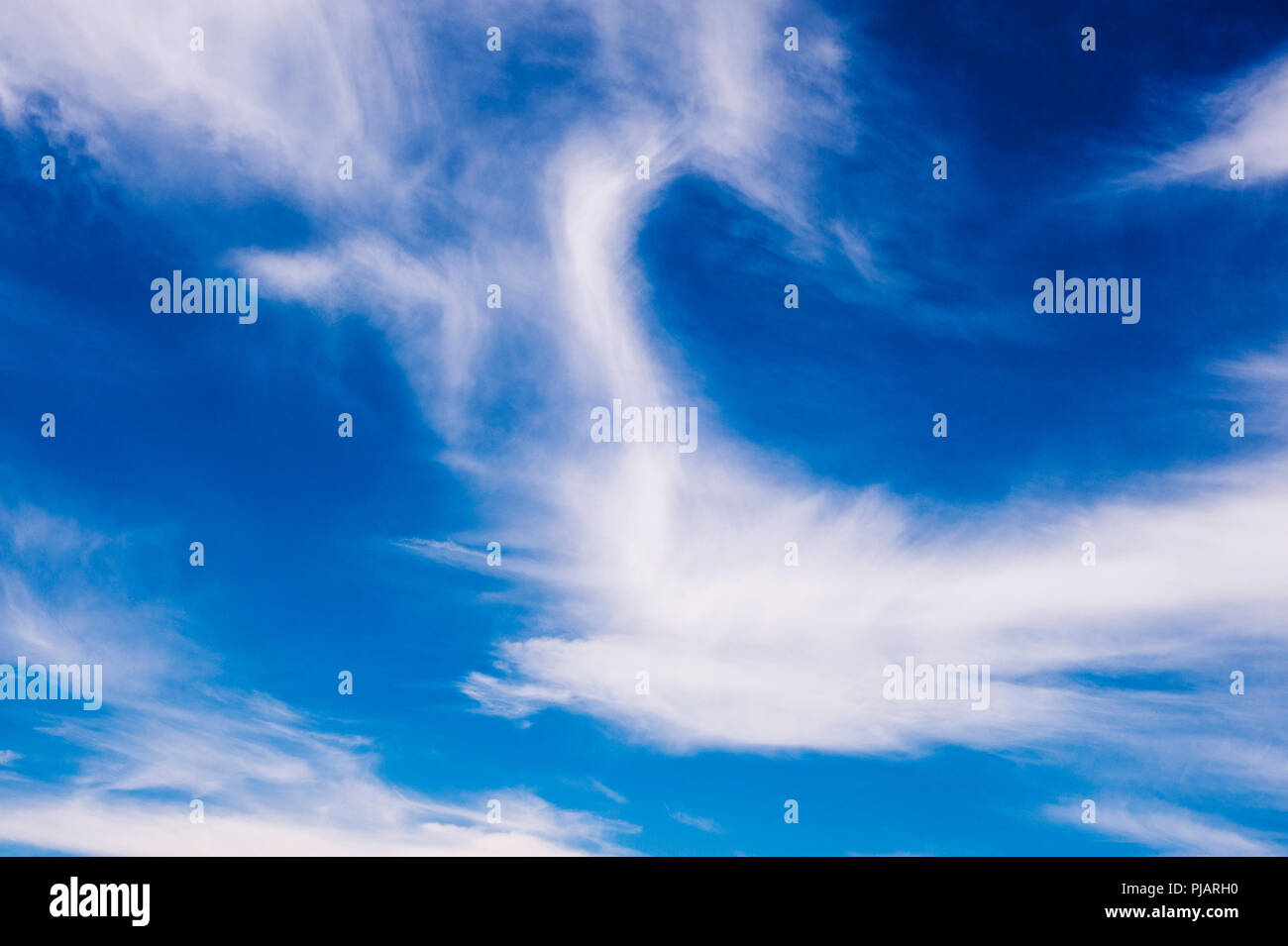 Cirrus uncinus clouds in blue sky Stock Photo - Alamy