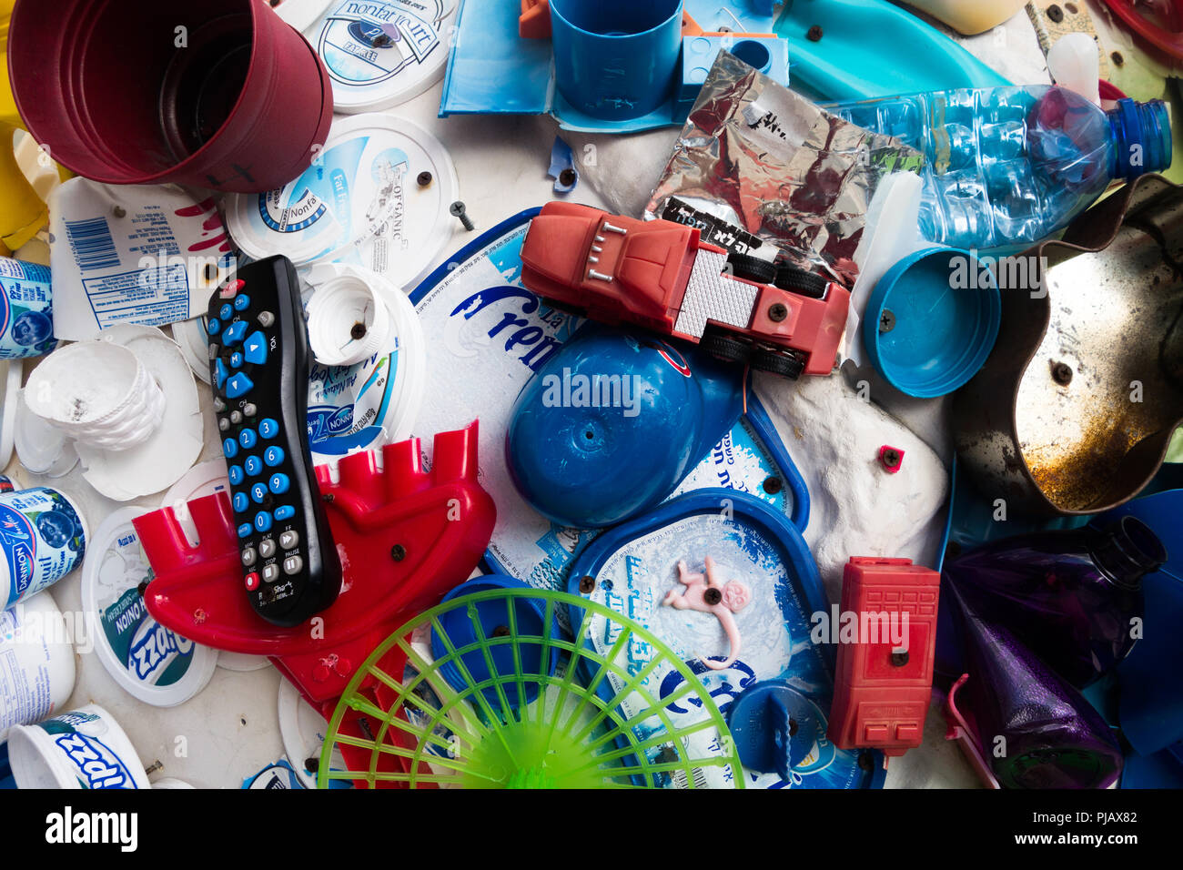 A collection of objects constructed from plastic on the surface of one ...