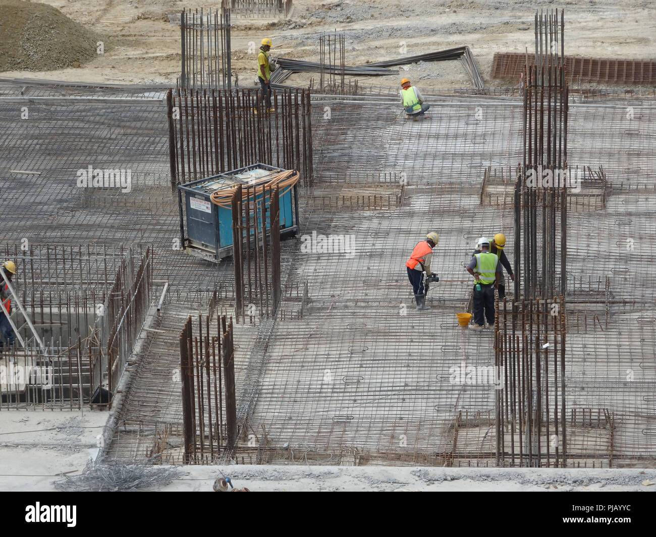 Construction workers installing reinforcement bar at the construction ...