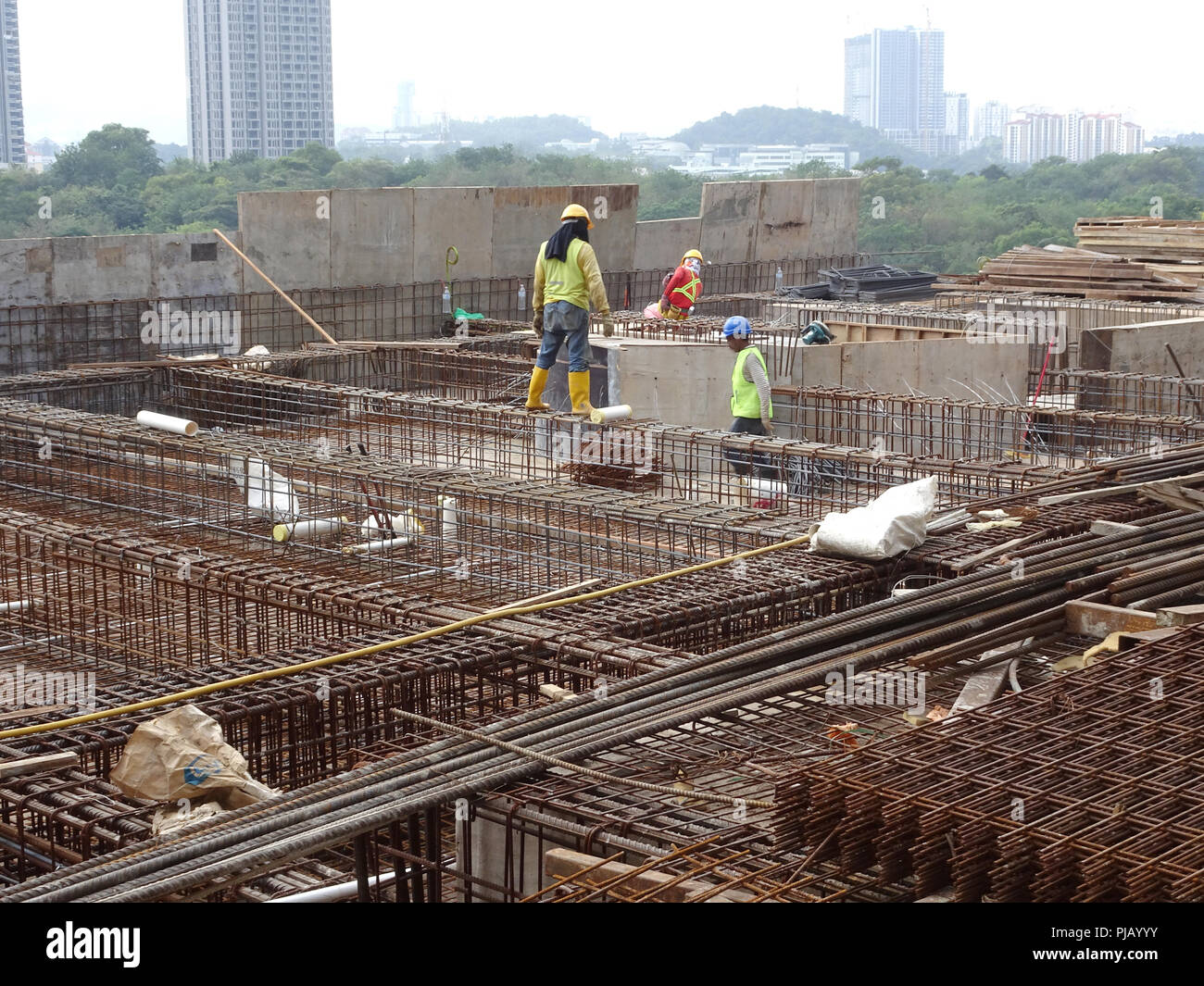 Construction workers installing reinforcement bar at the construction ...