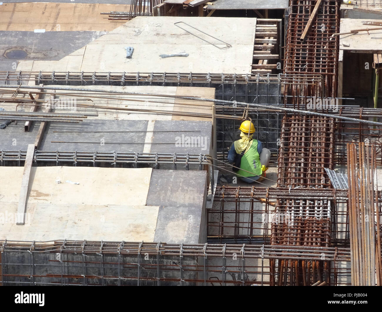 Construction workers installing reinforcement bar at the construction ...