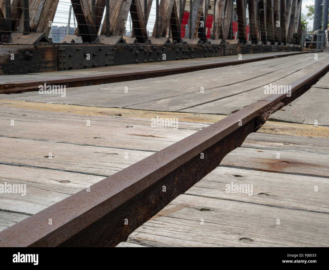 Close up of rusty railroad track in a wooden dock area Stock Photo - Alamy