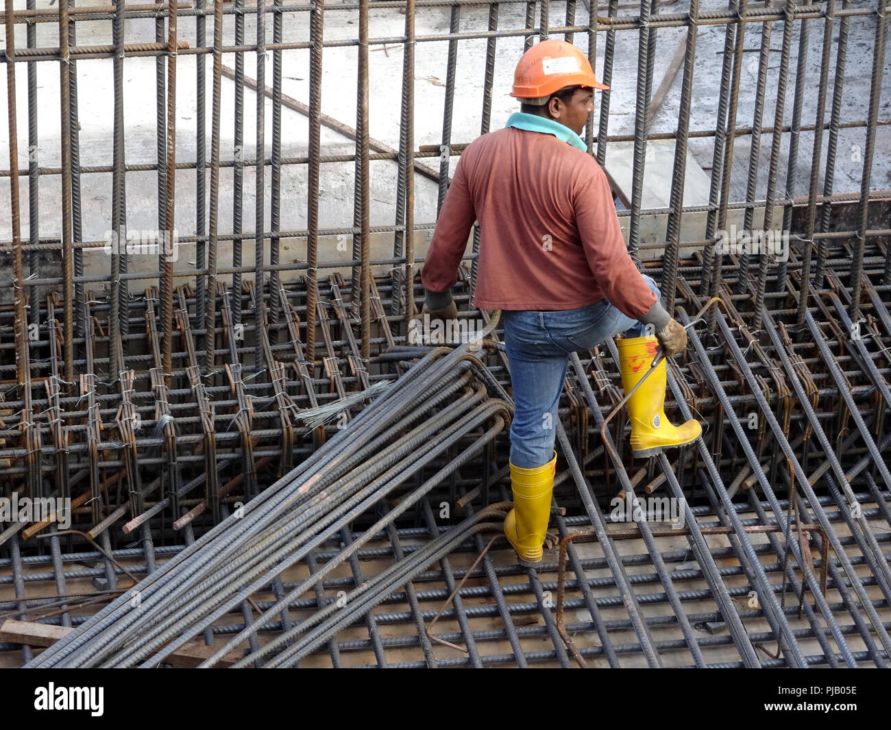 Construction workers installing reinforcement bar at the construction ...