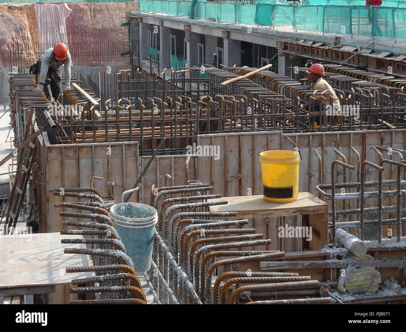 Construction workers installing reinforcement bar at the construction ...