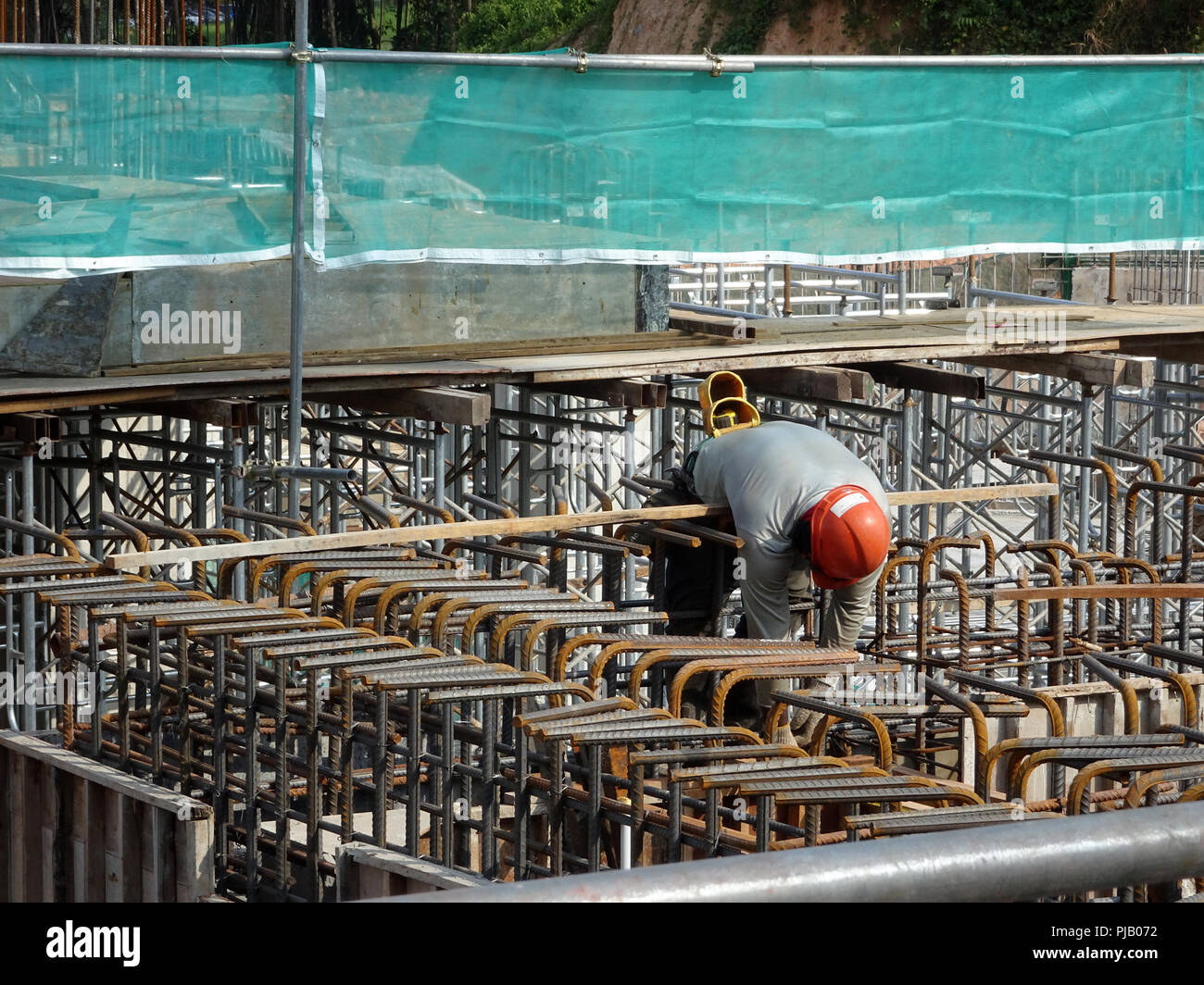 Construction workers installing reinforcement bar at the construction ...