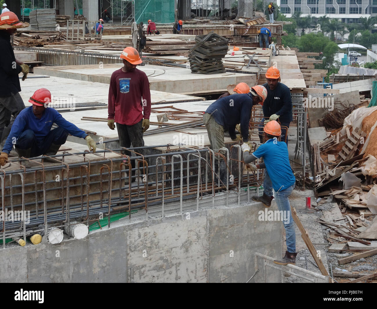 Construction workers installing reinforcement bar at the construction ...
