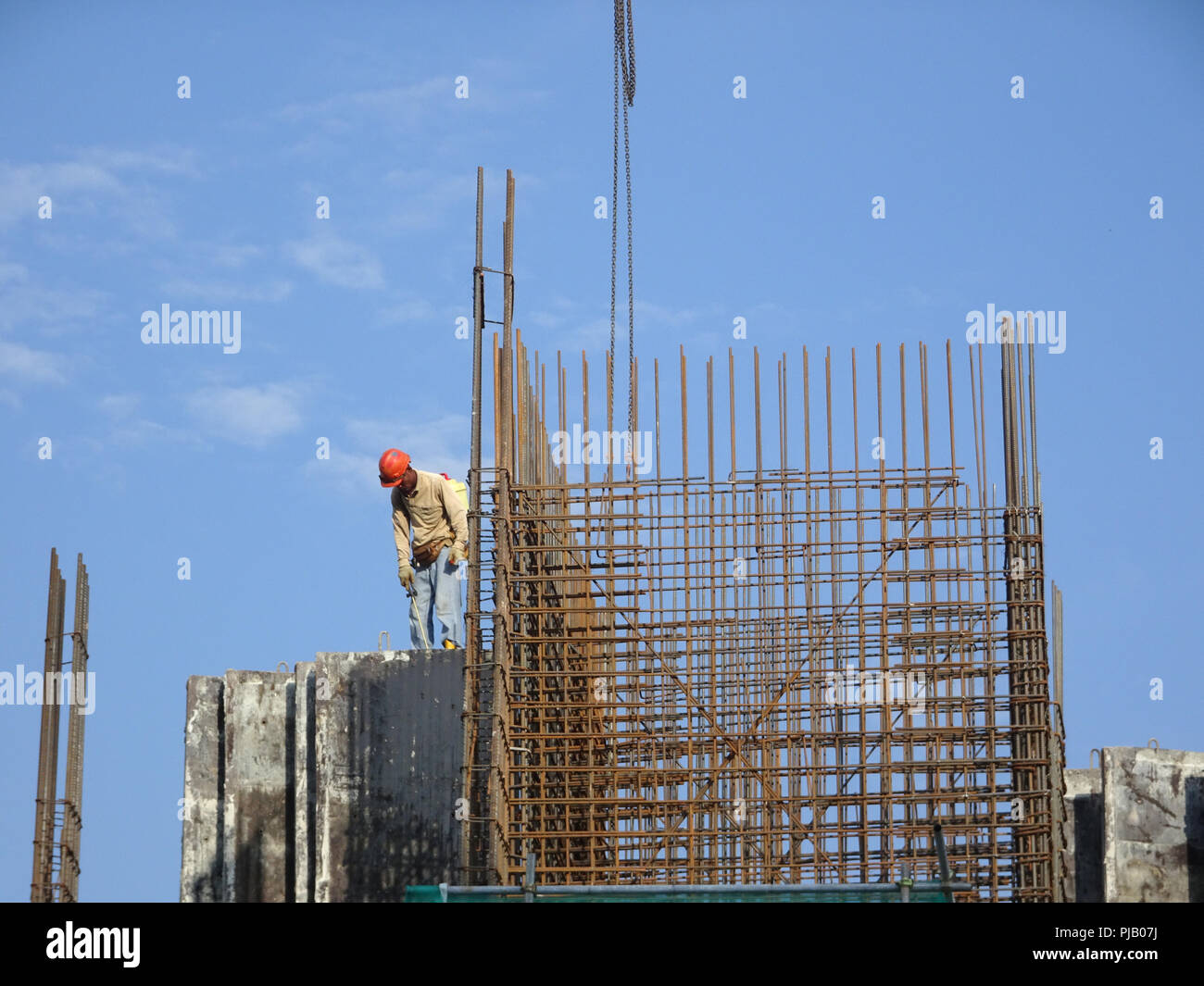 Construction workers installing reinforcement bar at the construction ...