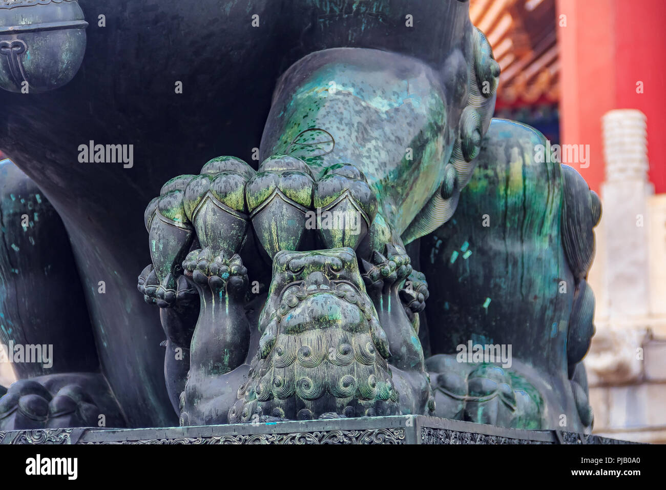 Close up of the traditional bronze female Imperial guardian lion ...