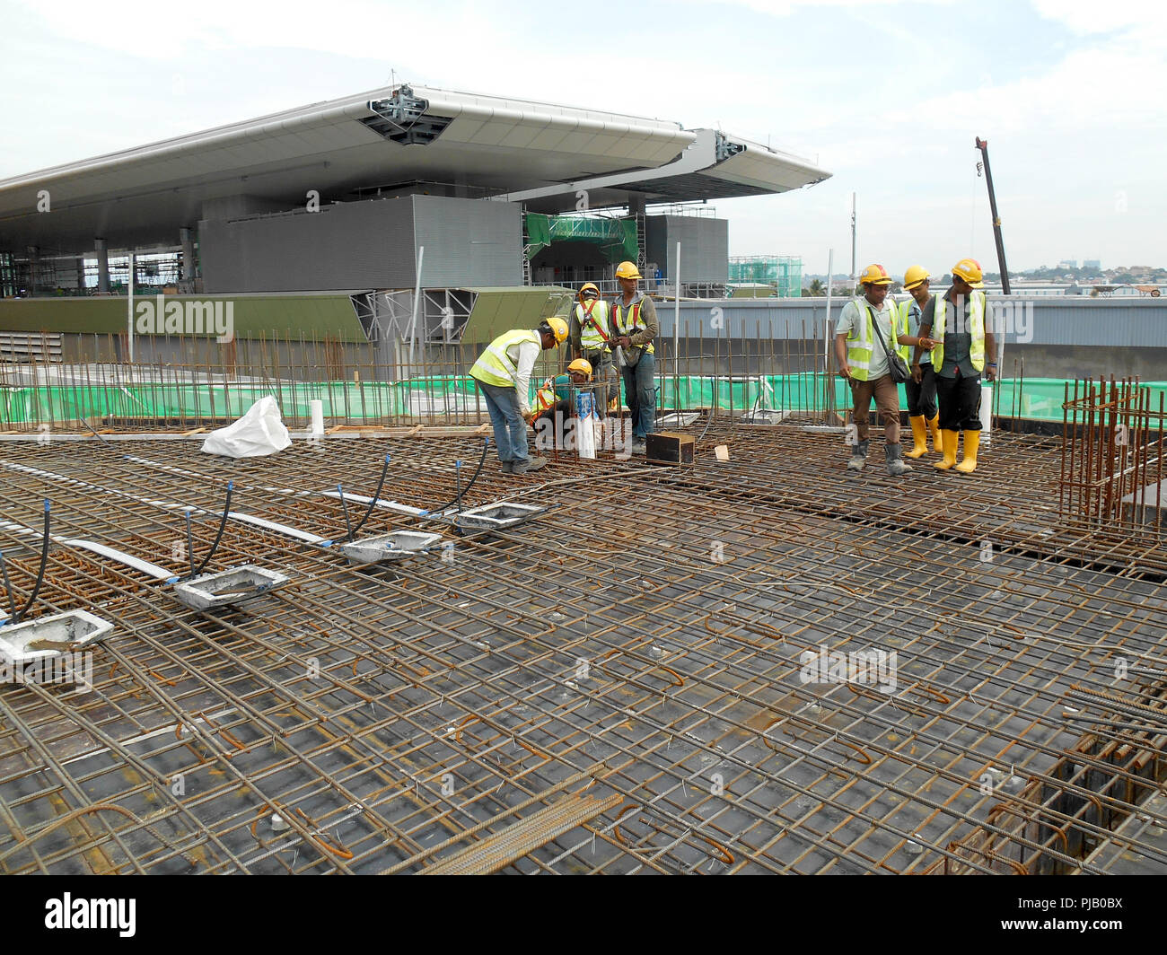 Construction workers installing reinforcement bar at the construction ...