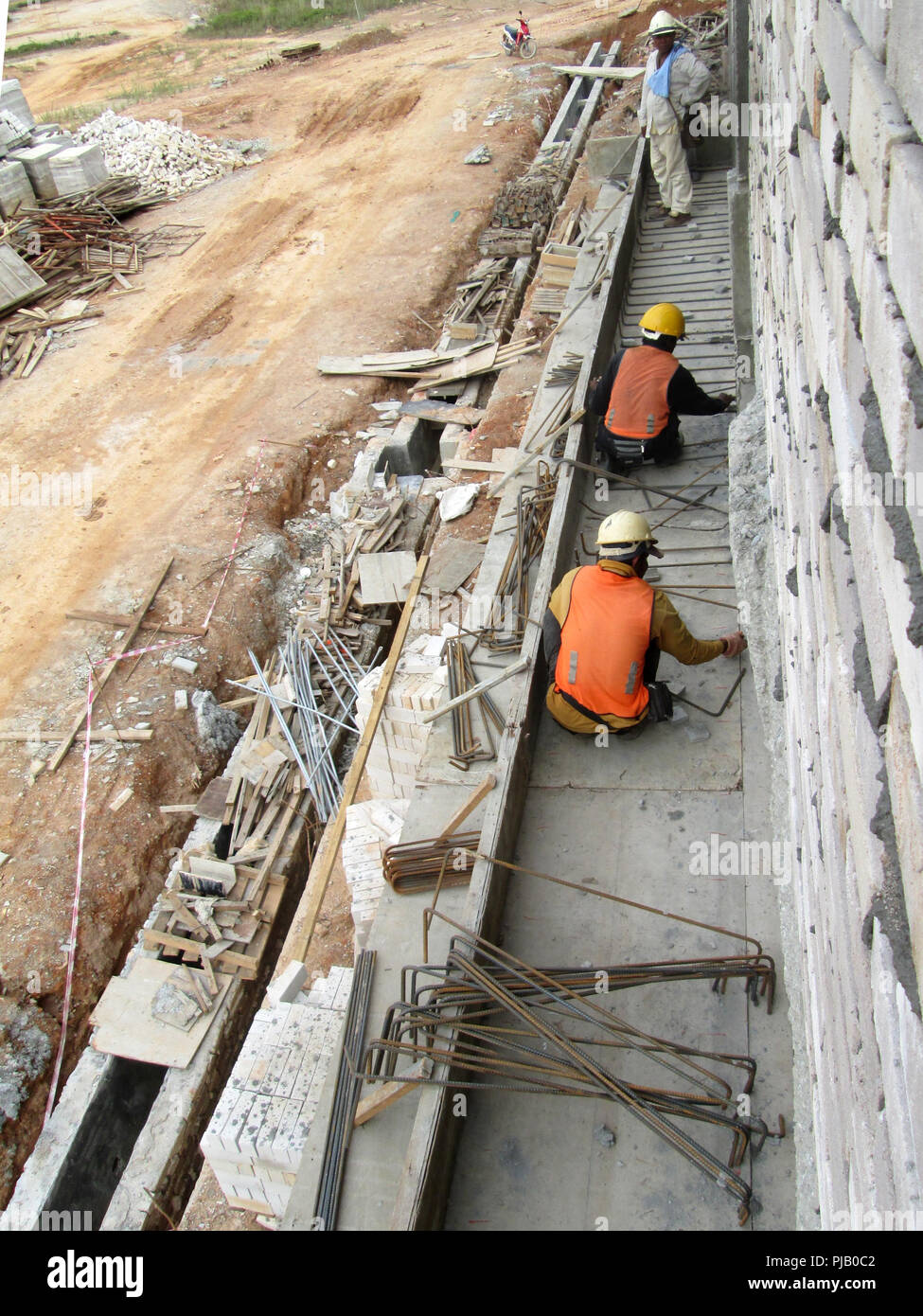 Construction workers installing reinforcement bar at the construction ...