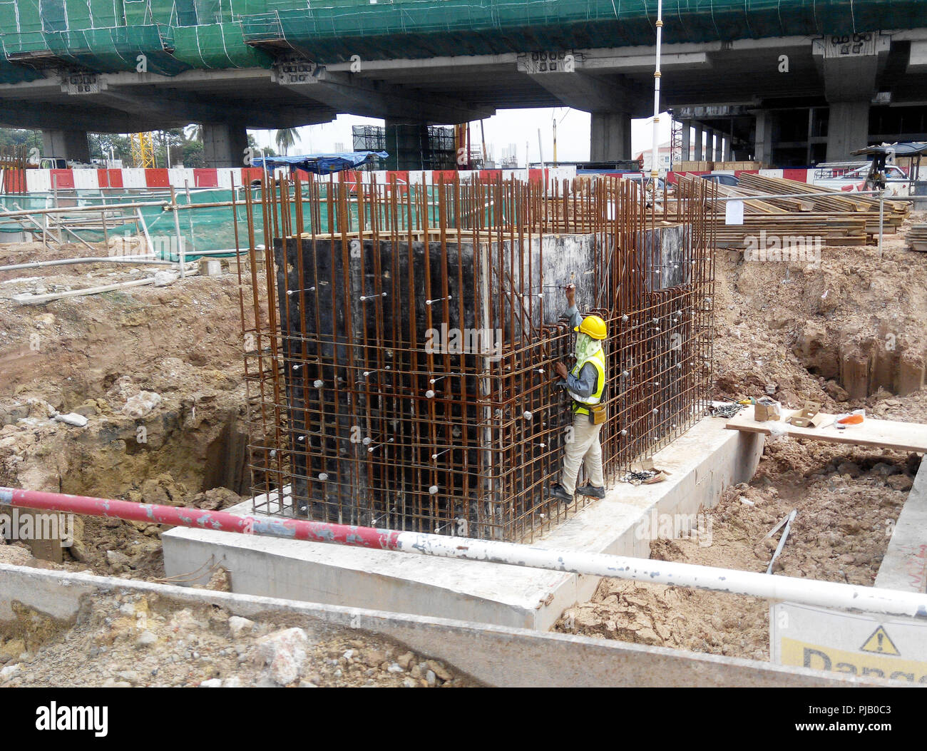 Construction workers installing reinforcement bar at the construction ...