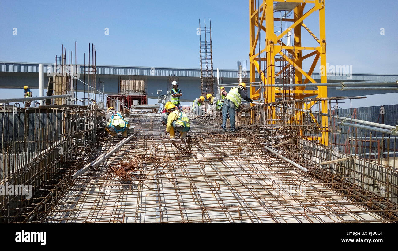 Construction workers installing reinforcement bar at the construction ...