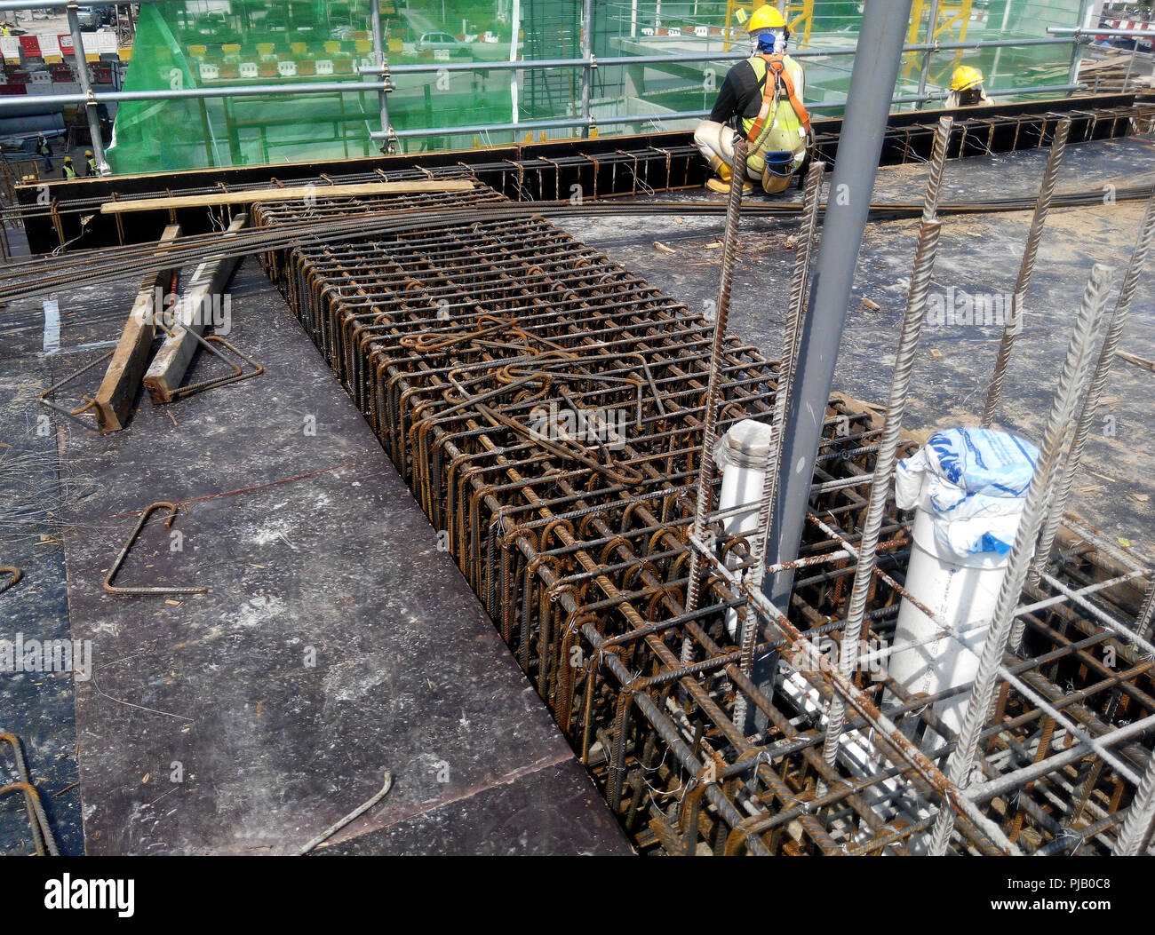 Construction workers installing reinforcement bar at the construction ...