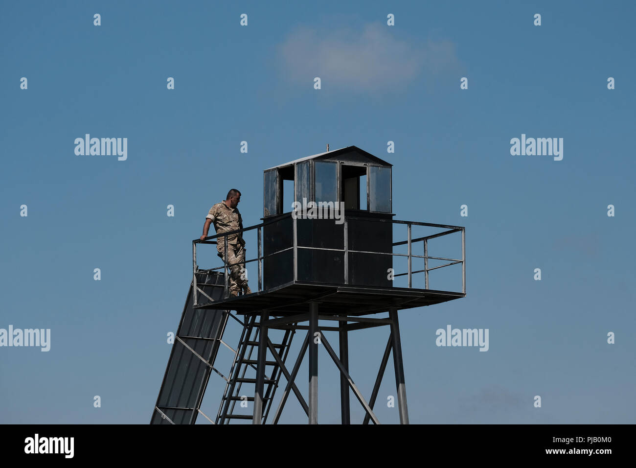 A Lebanese soldier stands outside a watchtower at the Lebanese side of ...
