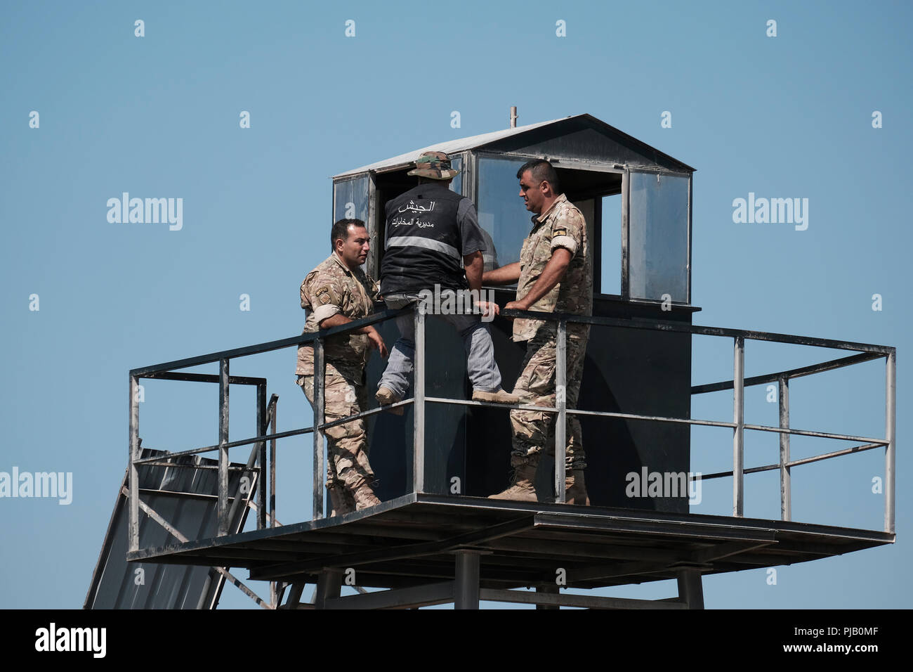 Members of the Lebanese Armed Forces stand on a watchtower at Lebanese ...