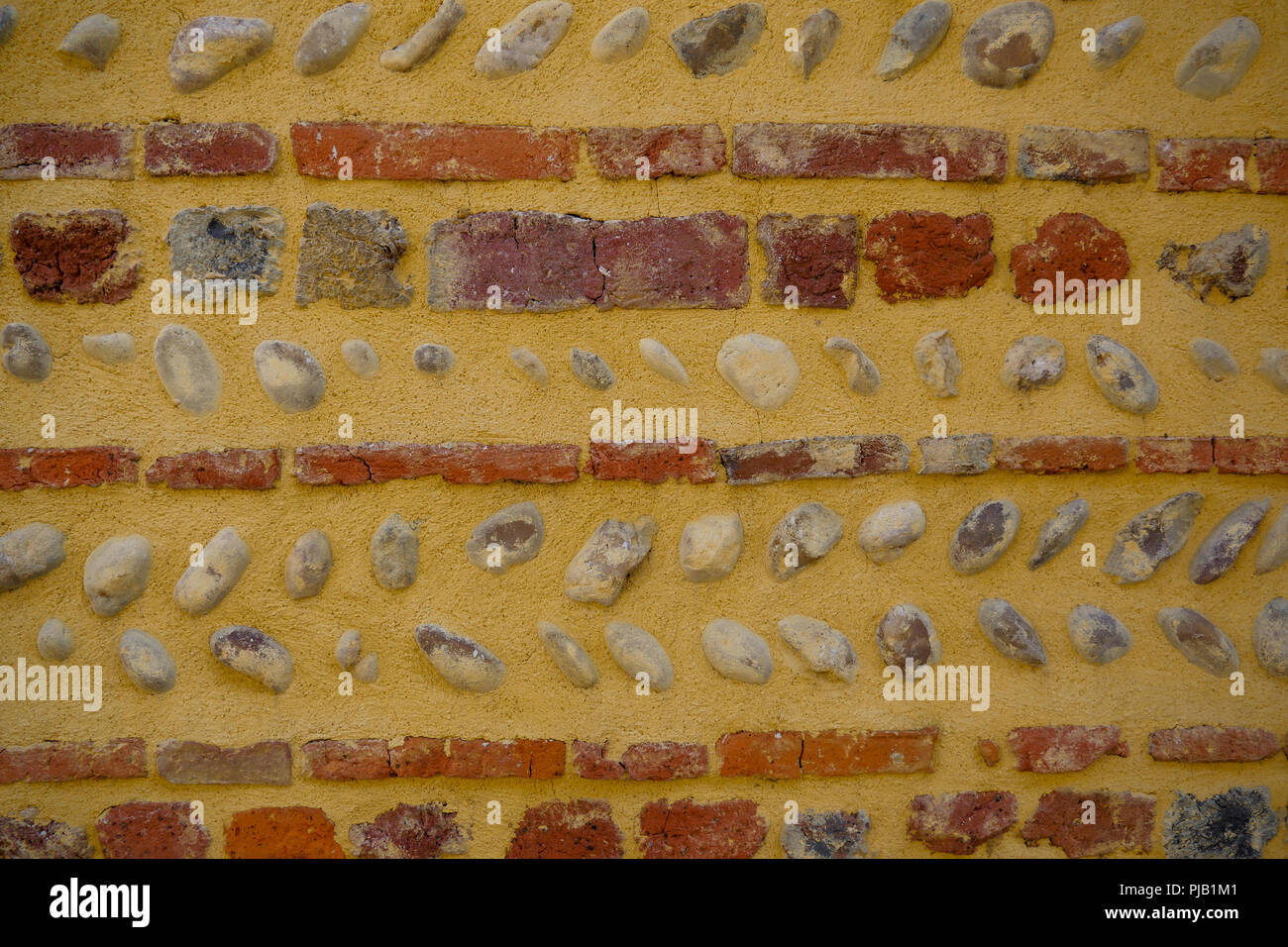 Traditional wall patern, made of pebbles and bricks, Villars les Dombes ...