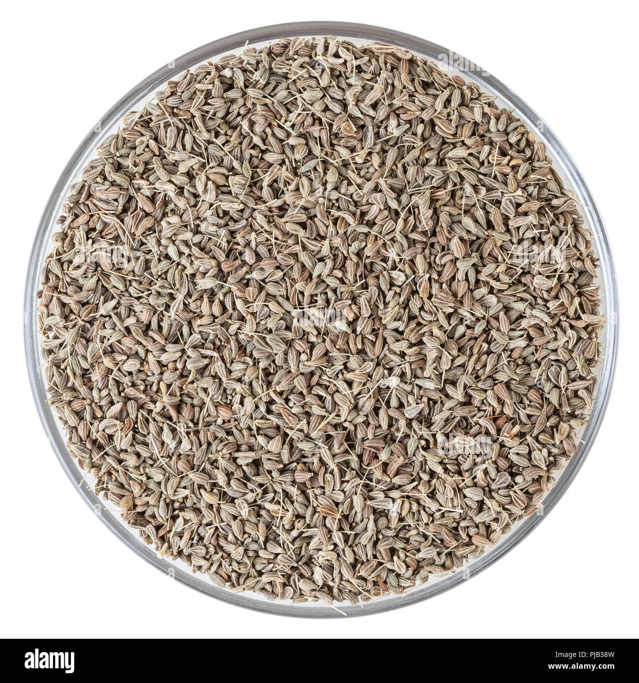 Anise seeds in glass bowl isolated on white background with clipping ...
