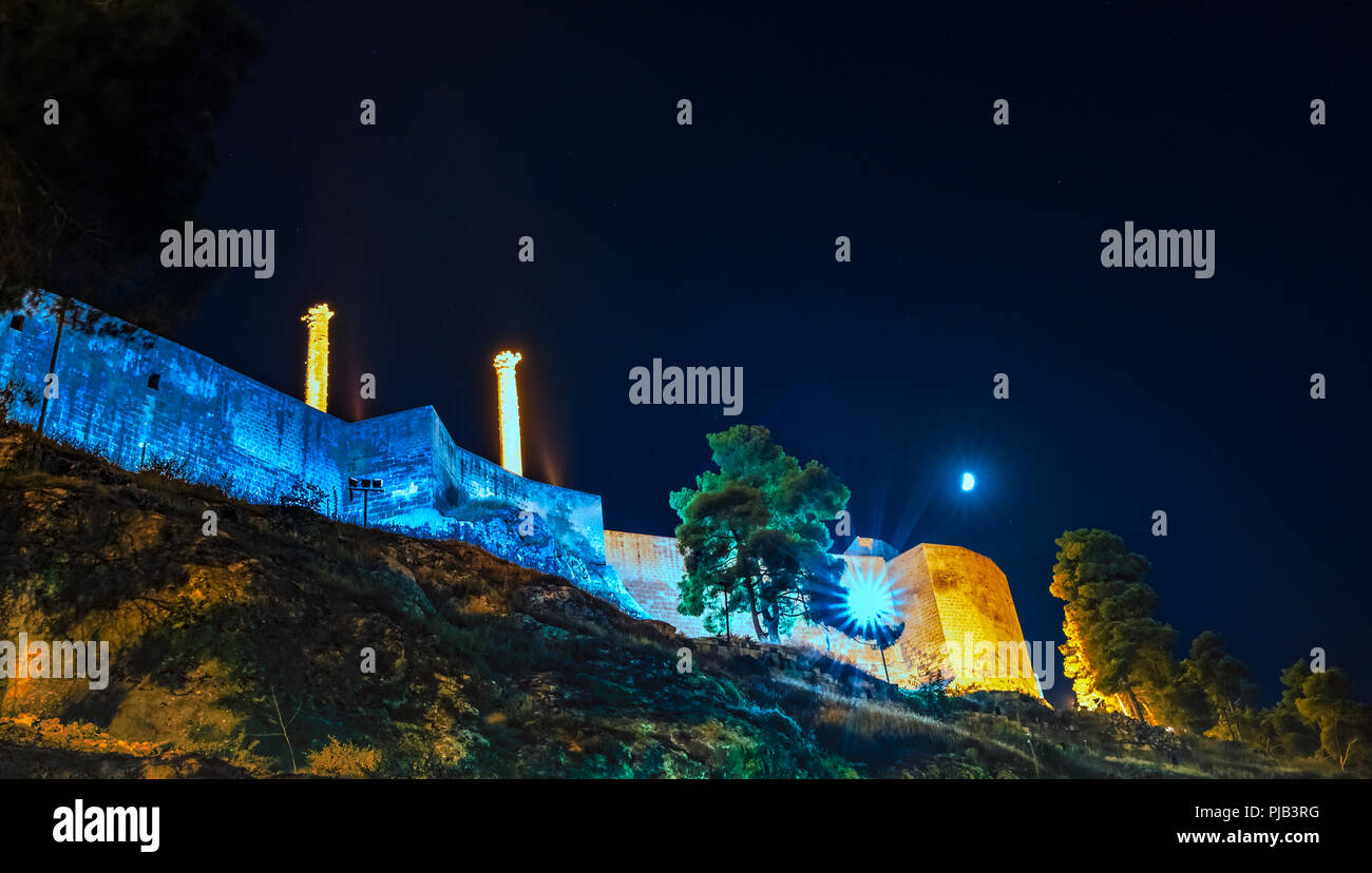Night view of Urfa Castle pillars and walls over Golbasi Park in ...