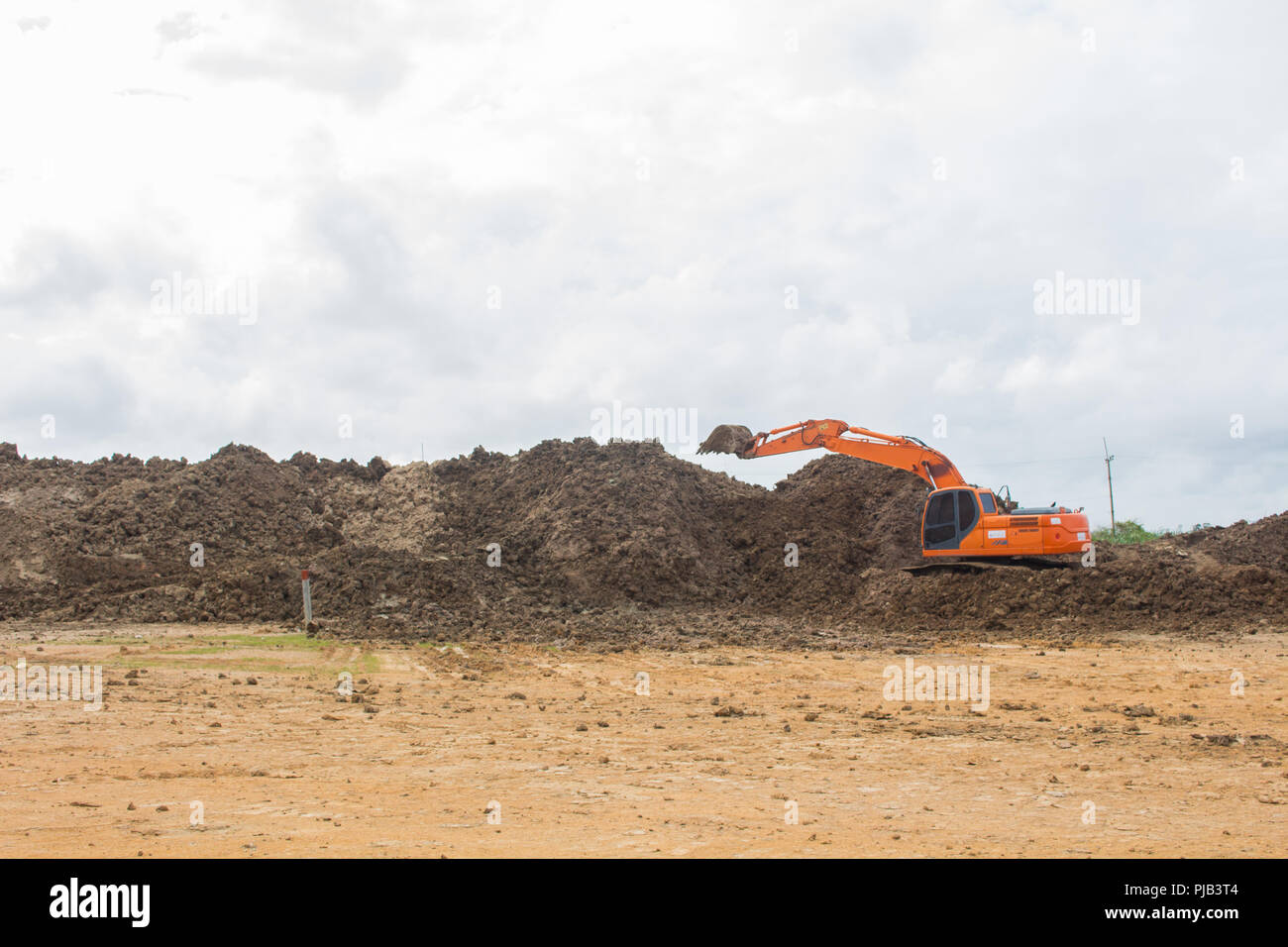 large diesel mechanical excavator digging earth machine at excavation ...