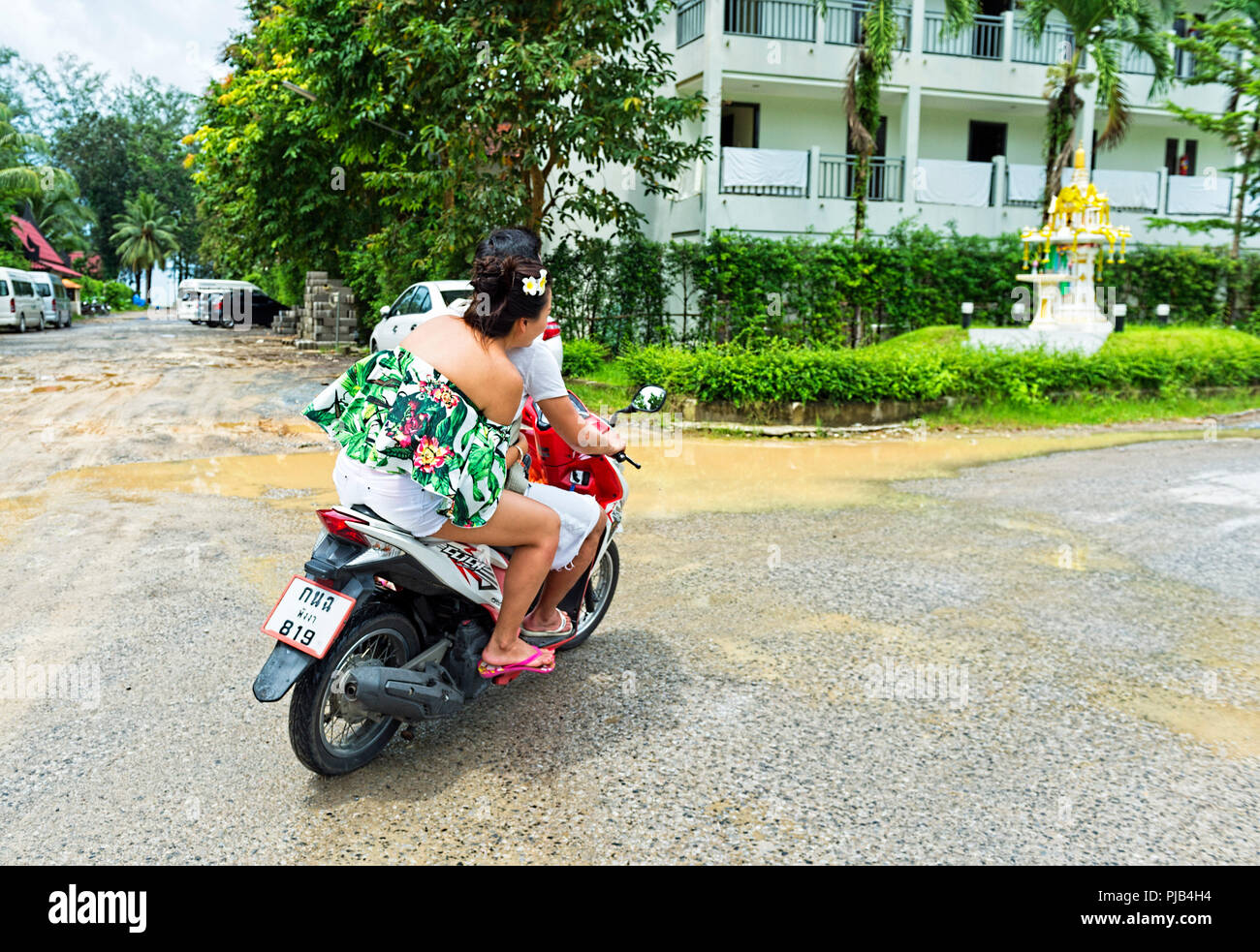 Two people on moped phuket thailand hi-res stock photography and images ...